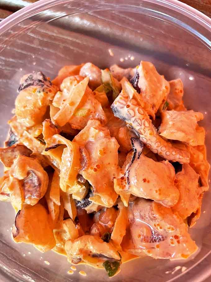 Tako (octopus) poke offers a delightful chew and absorbs flavors like a culinary sponge—an eight-armed hug for your taste buds.