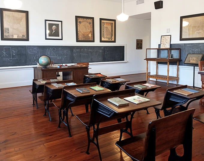 Step back in time in this meticulously preserved classroom where wooden desks await students who'll never arrive and history lessons never end.