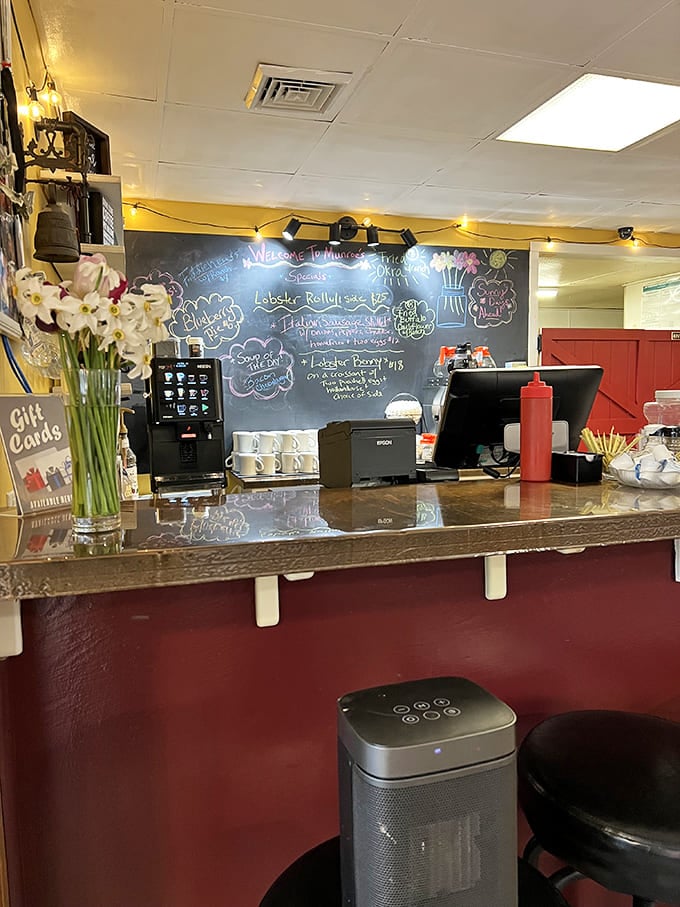 The command center of comfort food &ndash; where coffee brews, orders fly, and fresh flowers remind you this isn't just any roadside eatery.