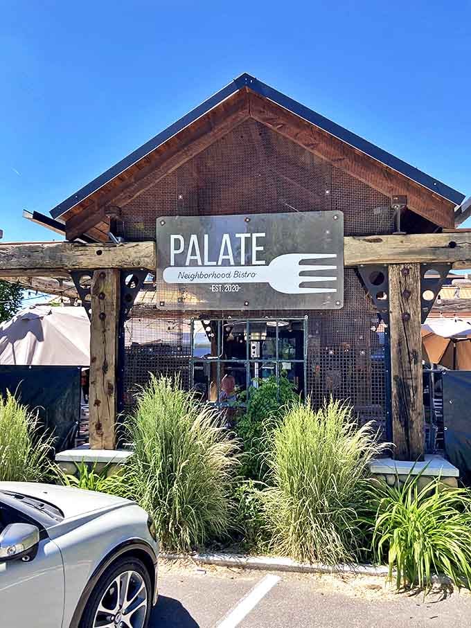 Palate Neighborhood Bistro embraces rustic-chic design where the architecture says "mountain cabin" but the menu promises sophisticated comfort.