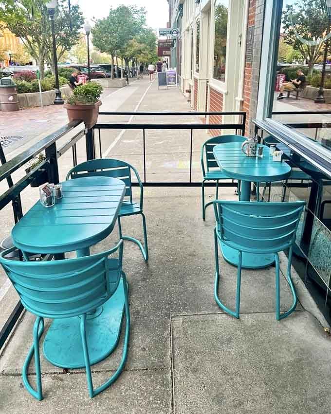 Teal chairs on the patio create the perfect perch for people-watching while contemplating which pie flavor to try next.