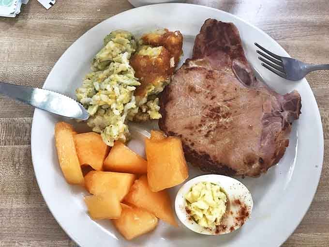 This pork chop with scrambled eggs and fresh cantaloupe isn't just breakfast – it's the reason alarm clocks were invented.