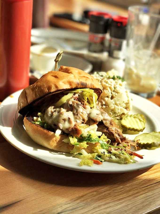 A pulled pork sandwich that doesn't hide behind excessive sauce &ndash; it stands proudly on its smoky merits with just enough slaw for textural counterpoint.