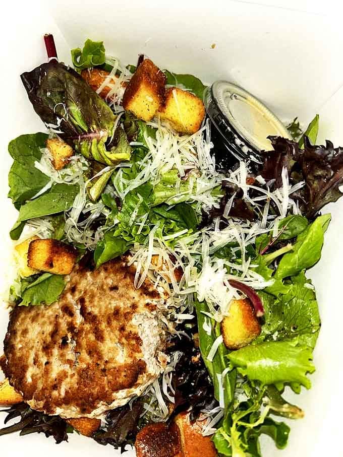 Even the salads deserve respect here &ndash; fresh greens, croutons, and a perfectly cooked patty prove healthy choices don't have to be boring.