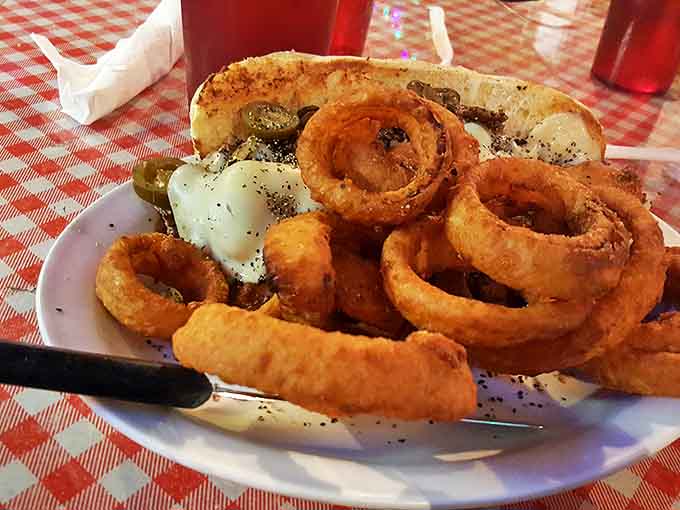 Onion rings that have achieved the perfect crunch-to-softness ratio, alongside a sandwich that means business. This is lunch with purpose.