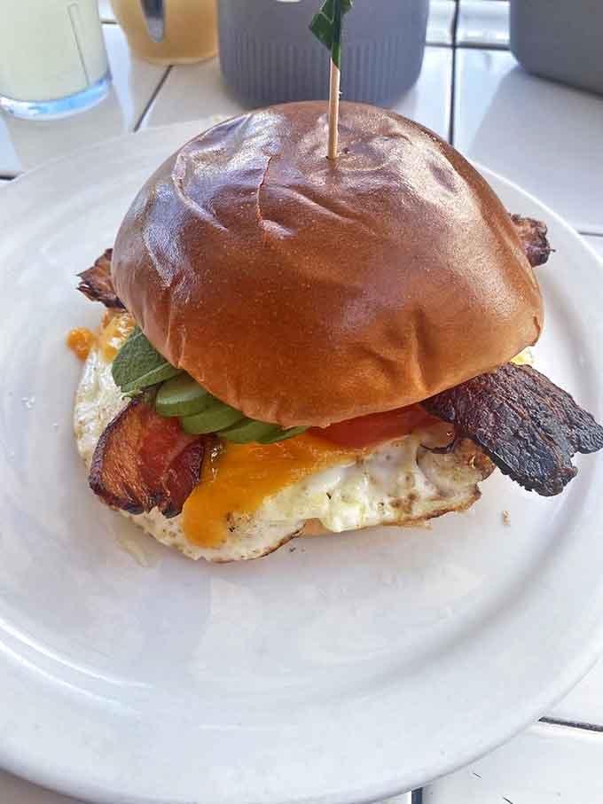 The breakfast sandwich that makes all other sandwiches question their life choices. That egg yolk is about to create a moment of pure joy.
