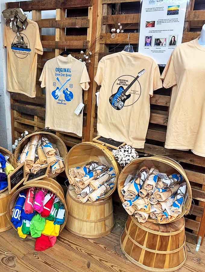 Delta blues meets cotton country on these t-shirts, where music heritage becomes wearable souvenirs stacked in rustic wooden barrels.