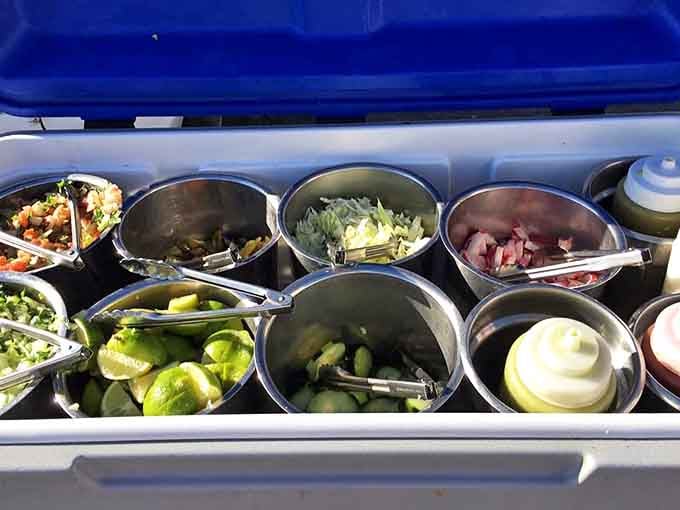 Taco architecture 101: Fresh toppings waiting their turn to transform simple tortillas into flavor-packed masterpieces. The lime wedges are non-negotiable!