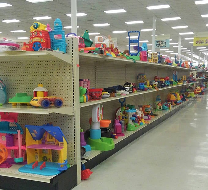 The toy section bursts with primary-colored potential, where plastic playsets await their chance to spark imagination in a new generation.