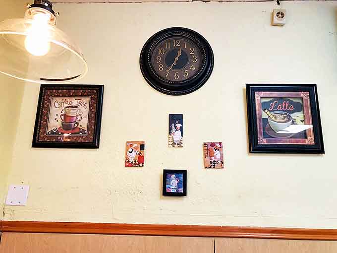The wall decor speaks coffee language&mdash;framed art and a vintage clock remind you it's always time for another cup.