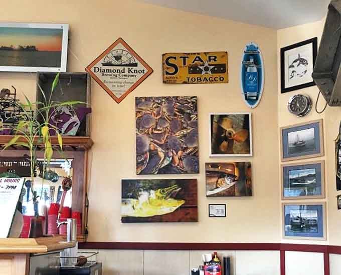 The walls tell stories of maritime adventures and local pride. Vintage signs and fishy artwork create the perfect backdrop for seafood feasting.