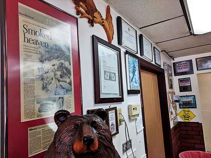 Wall of fame or smoke hall of fame? Newspaper clippings and awards tell the story of decades of barbecue excellence.