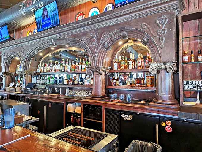 The bar's ornate woodwork feels like it was salvaged from a Victorian mansion that decided to loosen its corset and have some fun.