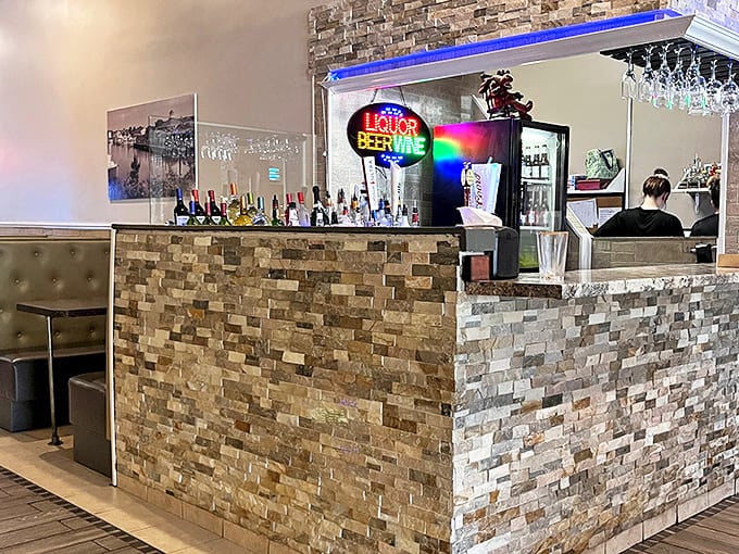 The bar area doesn't just serve drinks&mdash;it creates community, with stone detailing that elevates it beyond your standard diner watering hole.