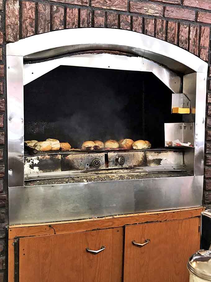 The charcoal grill at Mickey-Lu's has probably cooked more burgers than there are stars in the sky. That beautiful patina comes from decades of delicious dedication.