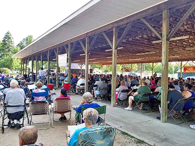 Community gatherings under open pavilions remain the heartbeat of small-town Michigan, where neighbors become family through shared experiences.