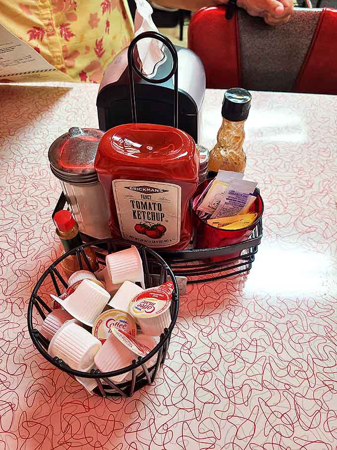 The condiment caddy &ndash; that tabletop United Nations of flavor where ketchup diplomacy and sweetener politics play out over morning coffee.