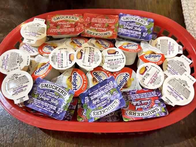 The condiment basket&mdash;where grape jelly packets and strawberry jam live in harmony, waiting to elevate your breakfast experience.