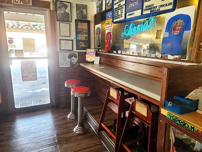 The counter where dreams are ordered and served. Those red-topped stools have supported the weight of Tupelo's stories for generations.