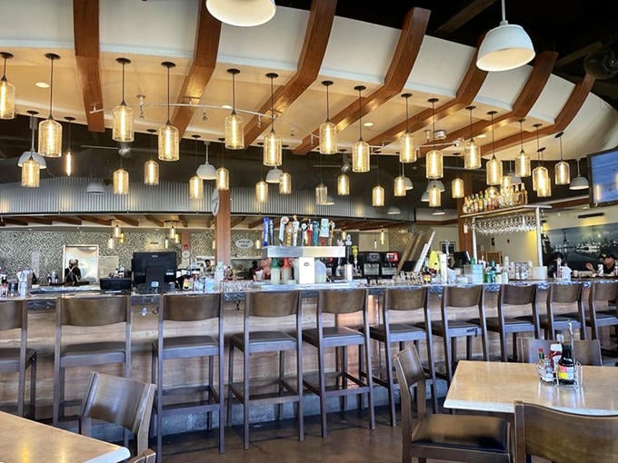The bar area's curved wooden beams and pendant lights create a nautical elegance. Hemingway would approve of this spot for a sundowner.