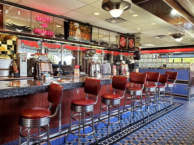 The counter where regulars become family and first-timers become regulars, all under the watchful eye of the short-order symphony.