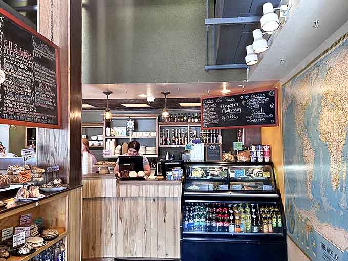 The command center where coffee dreams become reality. Wooden counters, chalkboard menus, and a display case of temptations make ordering the hardest part of your day.