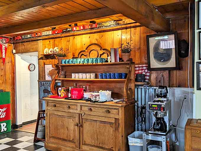 That wooden hutch isn't from a designer catalog – it's the real deal, holding decades of diner history and coffee mugs with equal dignity.