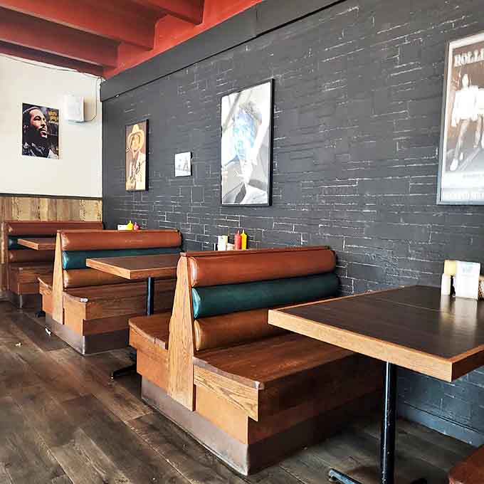 Cozy booths against dark brick walls create the perfect backdrop for the colorful flavor explosions that are about to happen on your plate.