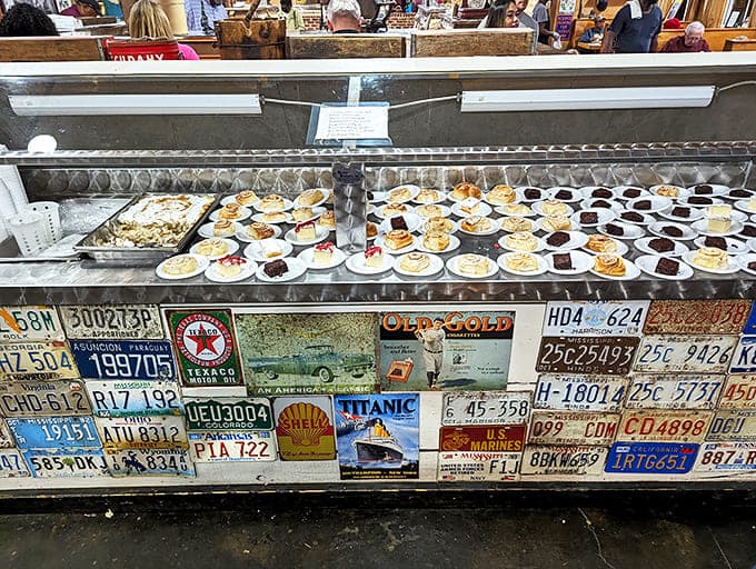 Dessert display that stops conversations mid-sentence. Those license plates below aren't just decoration&mdash;they're from pilgrims who traveled far for sweetness.