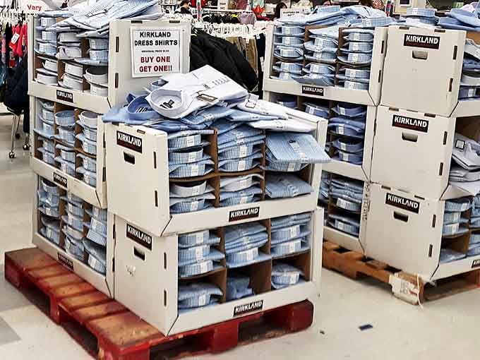 Kirkland dress shirts stacked higher than your weekend to-do list, with a buy-one-get-one deal that makes corporate America suddenly more affordable.