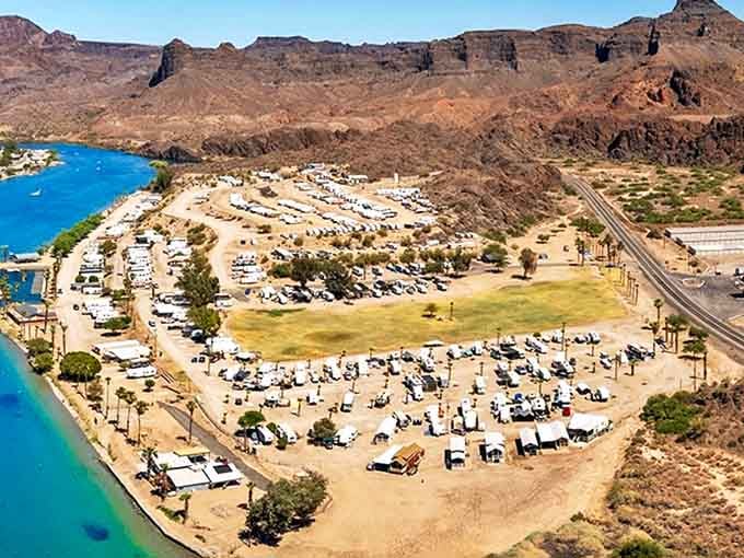 RV paradise meets waterfront camping. When your temporary address includes both desert mountains and river access, why would you ever leave?