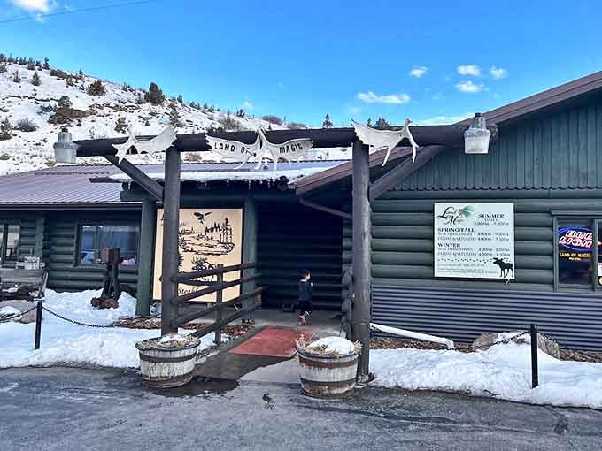 Winter in Montana means the Land of Magic looks even more magical. Snow-dusted entrance with those wooden barrels standing guard like chubby sentinels.