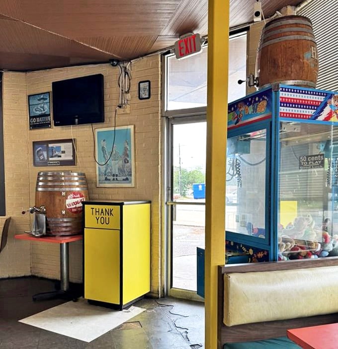 Even the exit area feels like a movie set, where wooden barrels meet arcade games in a charming collision of decades past.