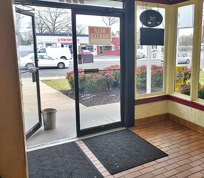 The entrance promises no frills, just honest food—a portal to a world where calories don't count and coffee never ends.