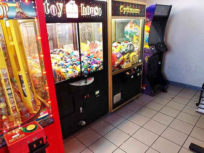 Where kids burn off pancake energy while adults finish their coffee. These claw machines have crushed more dreams than Hollywood casting directors.