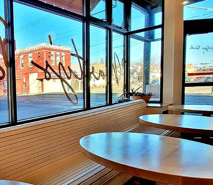 Sunlight streams through windows, illuminating wooden benches where sandwich dreams come true. Northeast Minneapolis never looked so appetizing.