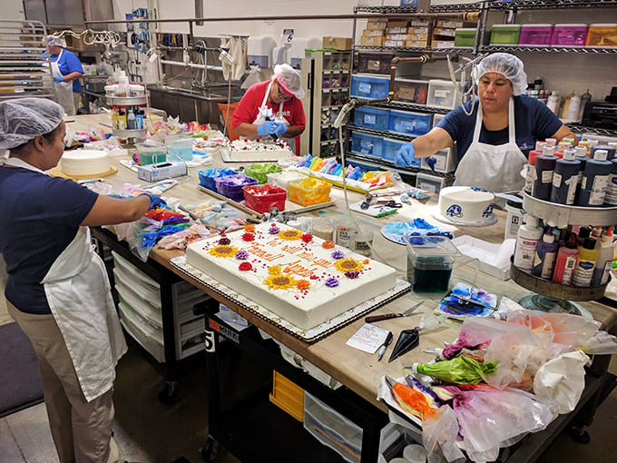 Behind the scenes magic where pastry dreams become reality. These artisans aren't just bakers – they're happiness engineers in hairnets.