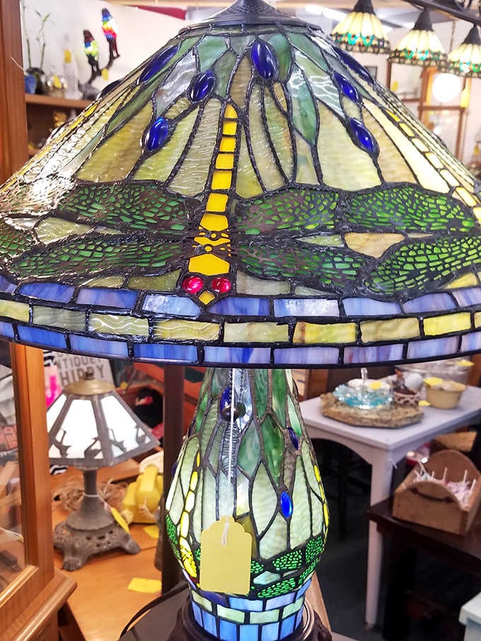Dragonfly dreams captured in stained glass! This Tiffany-style lamp transforms ordinary light into an art nouveau magic show.