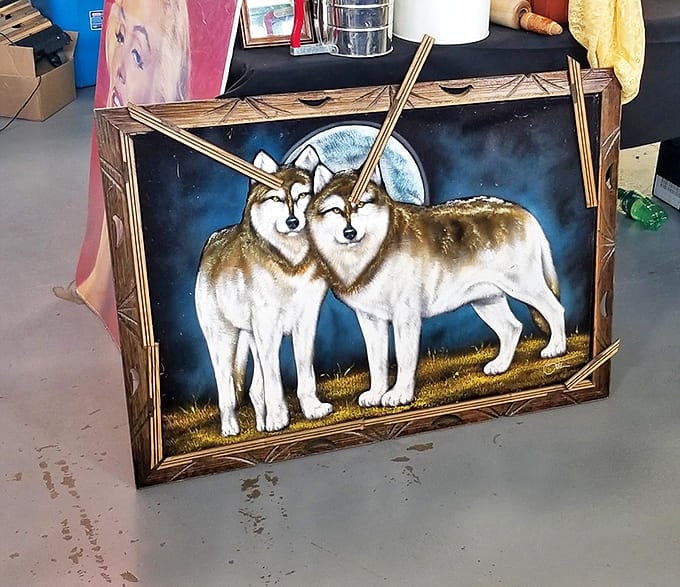 Wolf art that howls with 1980s magnificence. This moonlit masterpiece would look equally at home in a cabin retreat or an ironic apartment gallery wall.