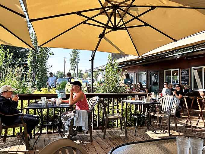 Summer in Montana means al fresco dining where mountain breezes enhance every bite under the protective watch of patio umbrellas.