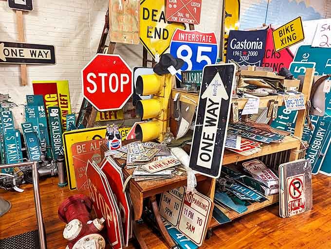 The road sign collection—where yesterday's directions become today's conversation pieces, and every STOP has a story.