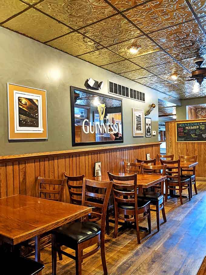 Where Guinness signs preside over wooden tables that have hosted countless stories, laughs, and clean plates. The tin ceiling reflects both light and good times.