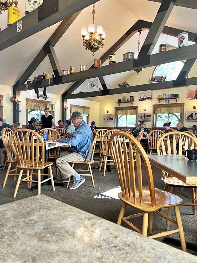 Wooden Windsor chairs and exposed beams create the backdrop for Jackson's daily symphony of clinking forks and neighborly conversations.