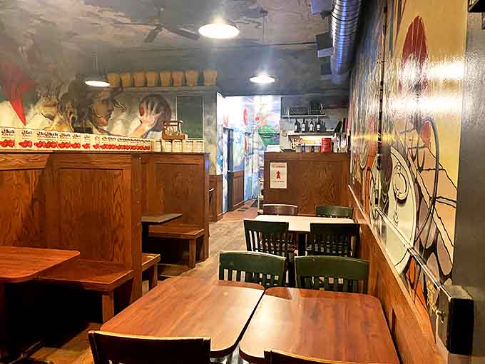 Dining room murals that tell stories while you eat. Like being inside an Italian storybook where the happy ending is always another slice of pizza.