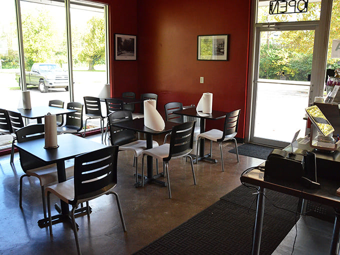 Red walls and simple furnishings create a distraction-free zone where the only appropriate focus is the plate before you.