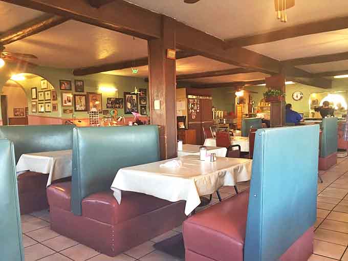 Booths designed for comfort, not Instagram backdrops. The kind of seating arrangement that says, "Stay awhile, we've got stories to tell."