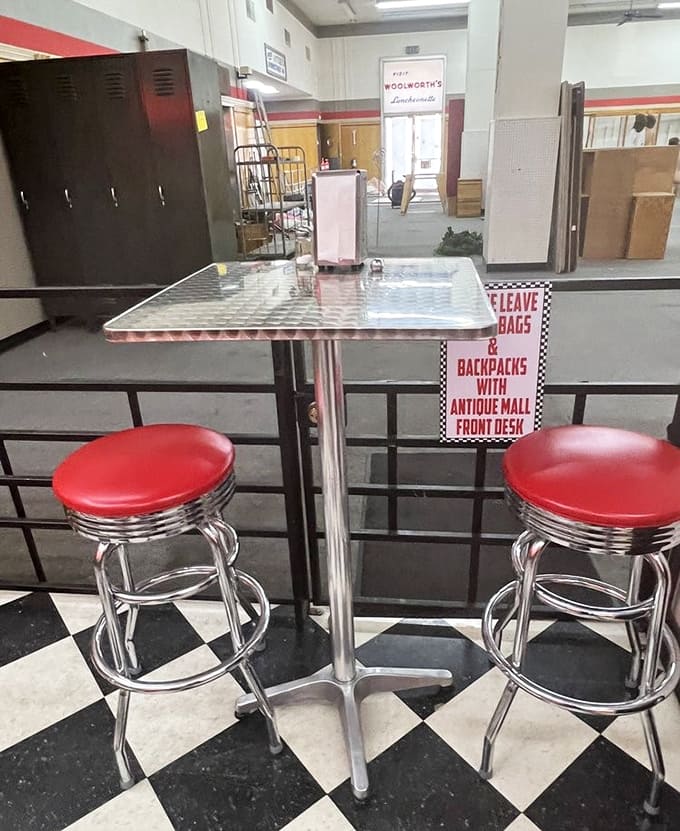 Red stools pop against the checkerboard floor like a real-life Edward Hopper painting, just waiting for you to become part of the composition.