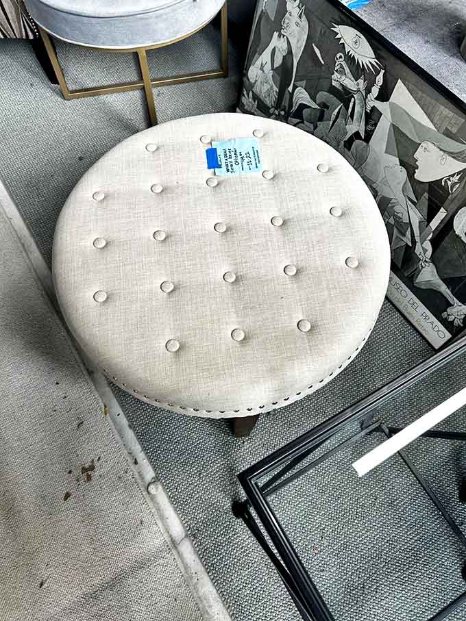 This tufted ottoman isn't just a footrest &ndash; it's a blank canvas for coffee table books, trays of appetizers, or emergency napping stations.