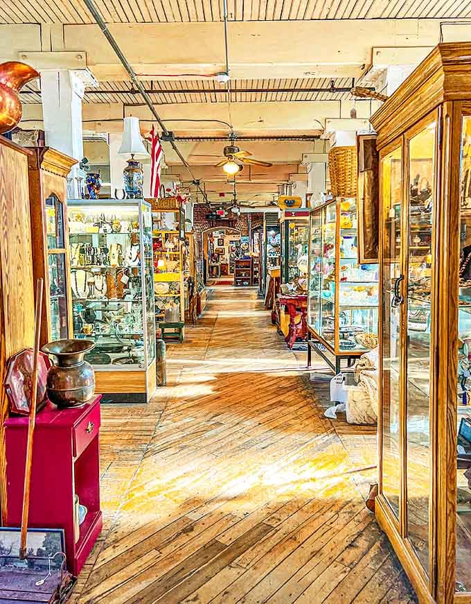 The antique store's main corridor stretches like a timeline of American design history, each display case a chapter waiting to be opened.