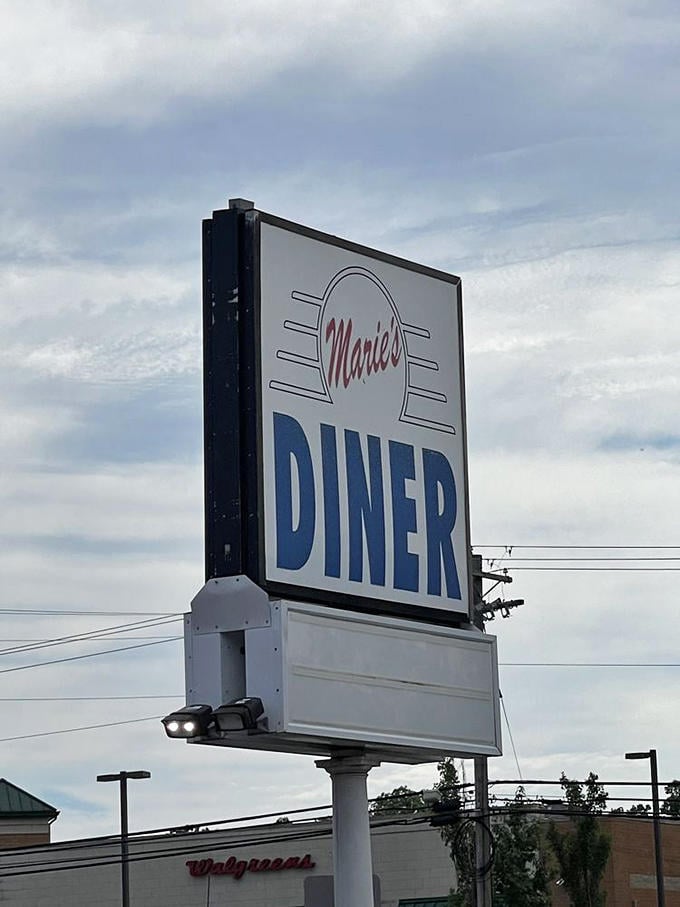 The Marie's Diner sign stands tall against Maryland skies, a retro promise of pancakes and possibility to all who pass by.